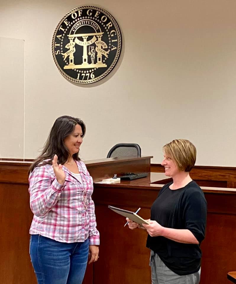 Judge Kerri Carter issues the Oath of office to Melissa Christiansen as ...